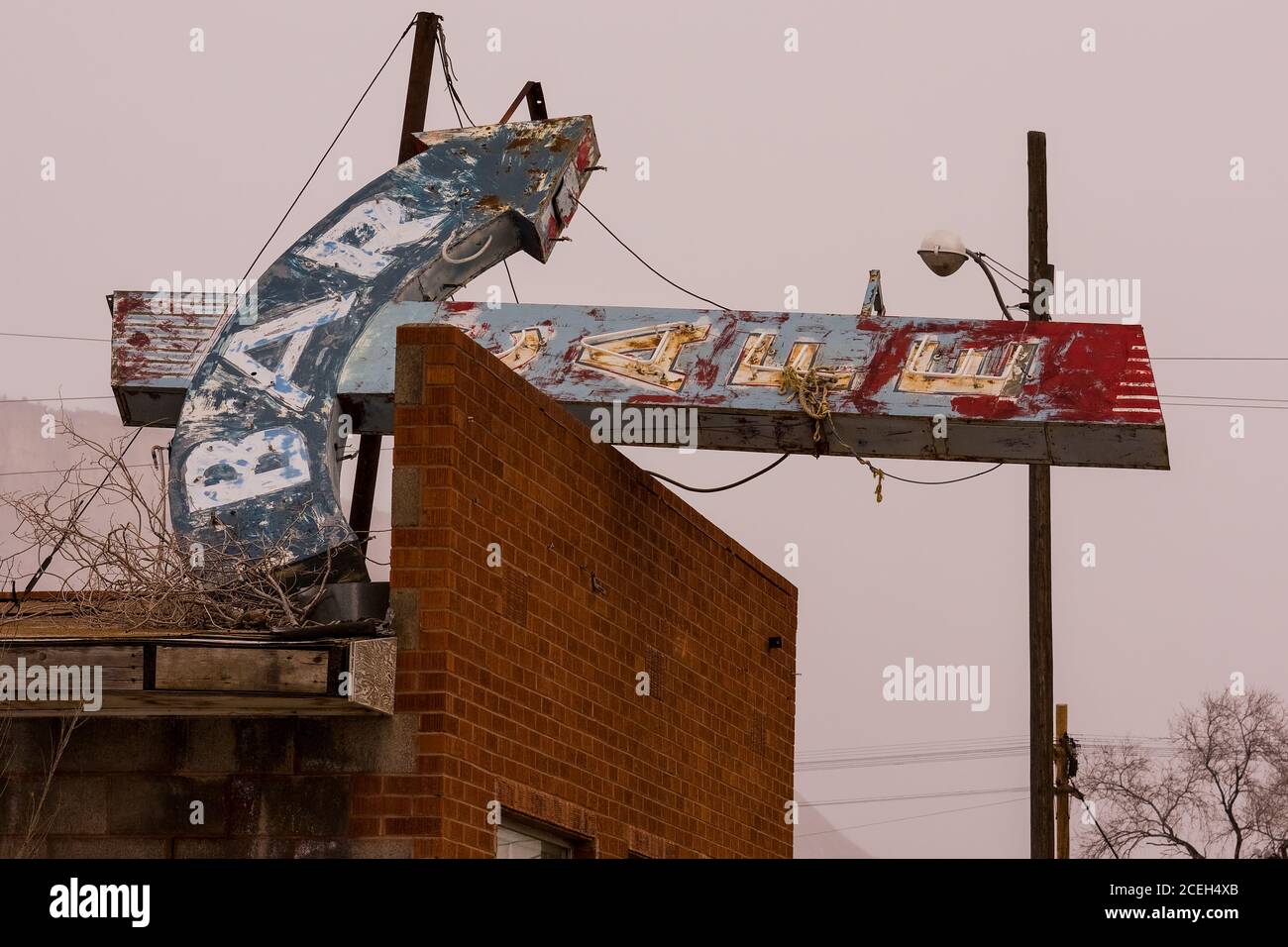 A fallen neon sign for a defunct business in the virtual ghost town of ...
