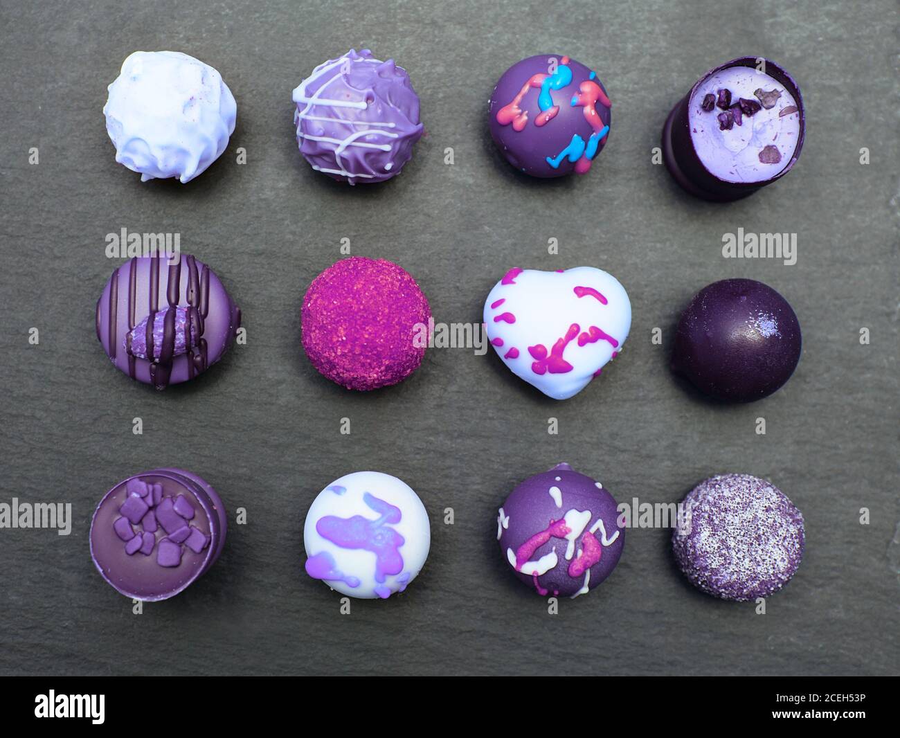 handmade chocolates. Colored chocolate candies sweets on a gray slate ...