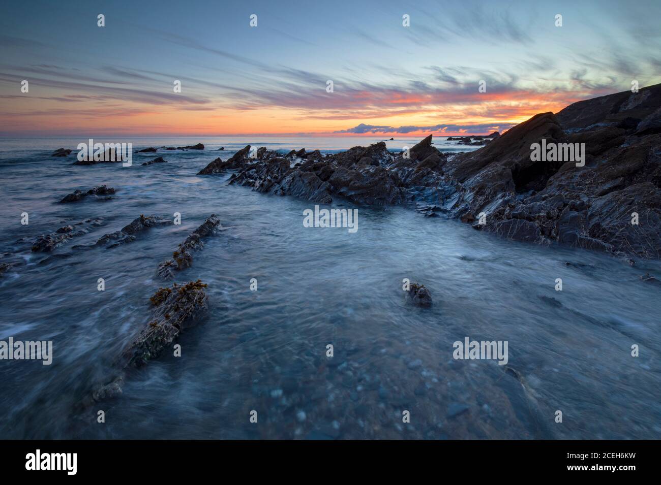 Sunset over Dollar Cove Gunwalloe off the Lizard Coast of Cornwall ...