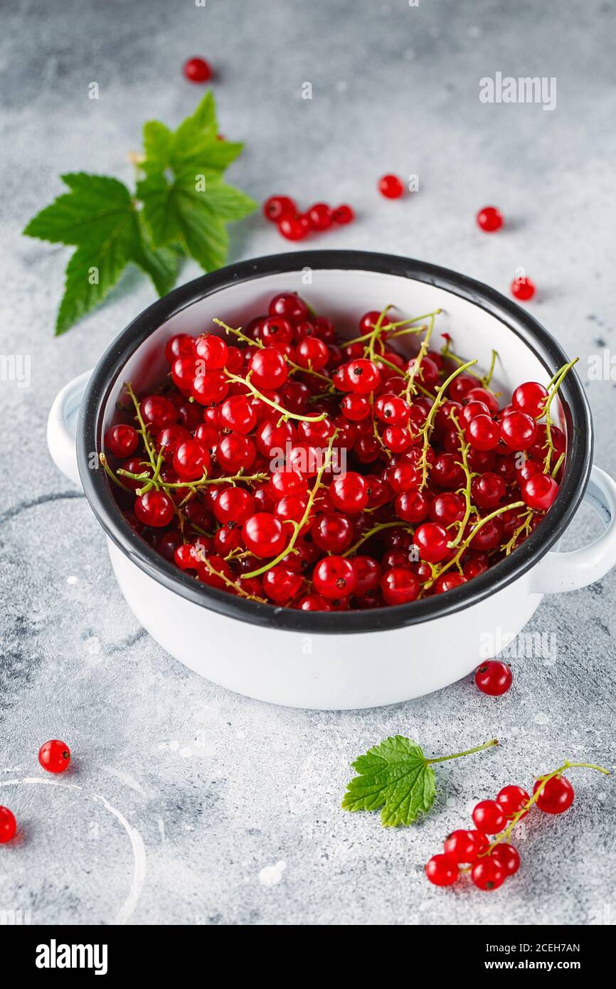 Ripe red currant berries in a bowl close up. Fresh ripe red currant on ...