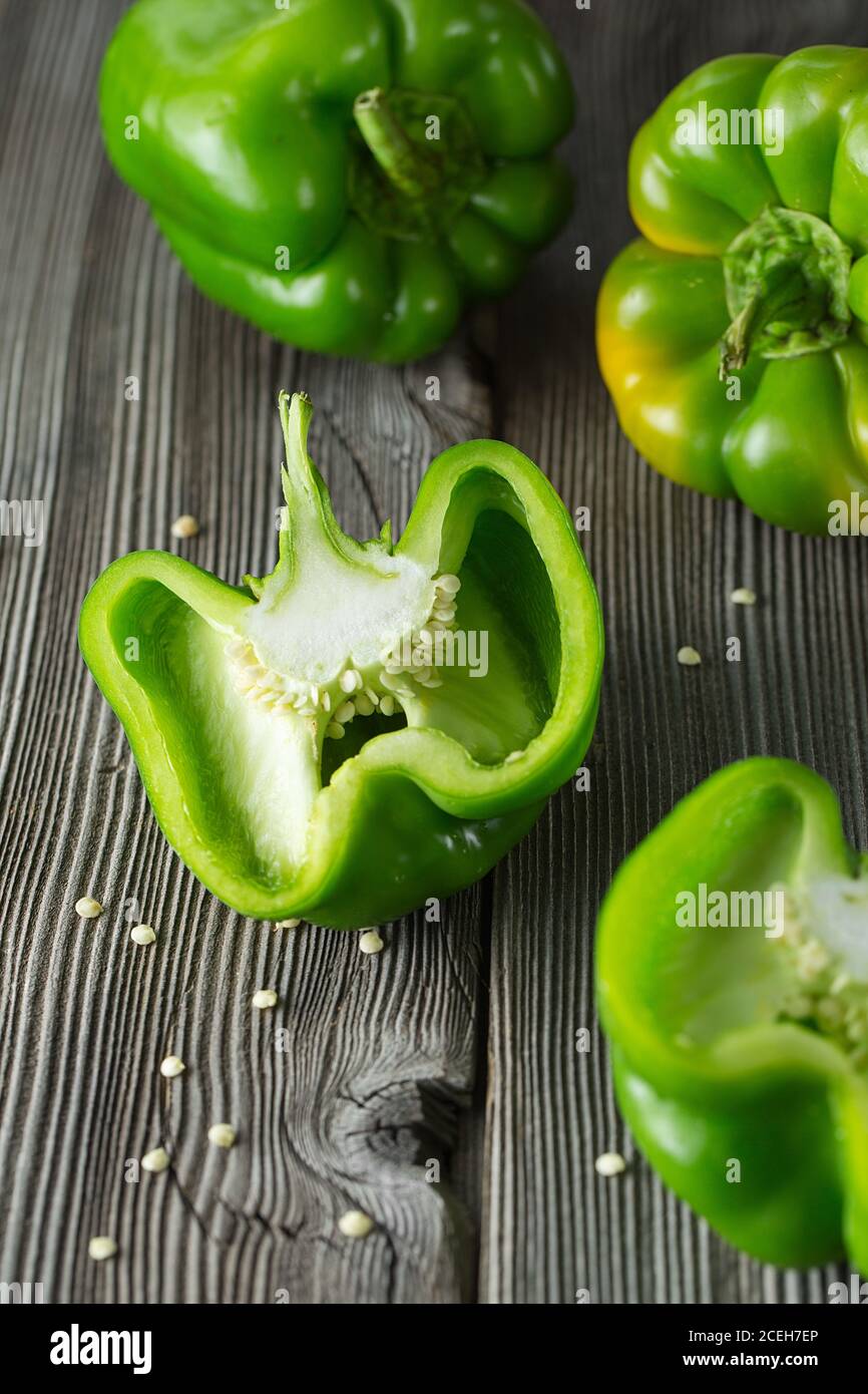 Sweet green pepper on wooden background. Fresh yellow green bell pepper ...
