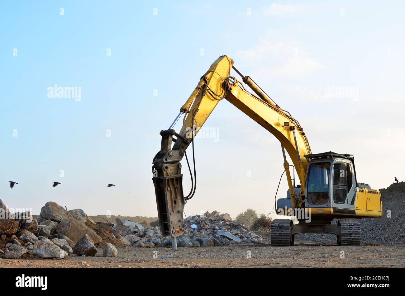 Crawler excavator with hydraulic breaker hammer for the destruction of ...