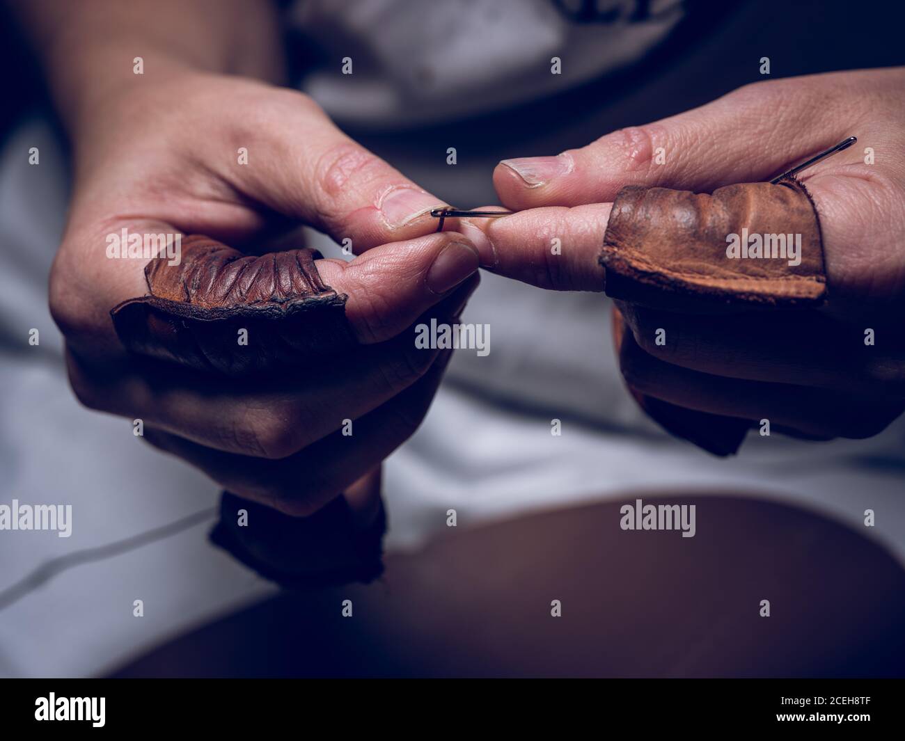 Hands thread needle hi-res stock photography and images - Alamy