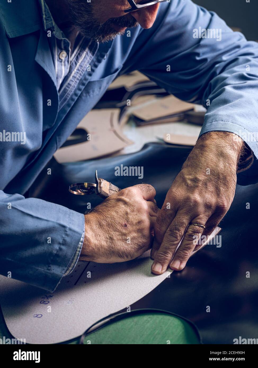Crop shoemaker cutting shoe template on leather Stock Photo - Alamy