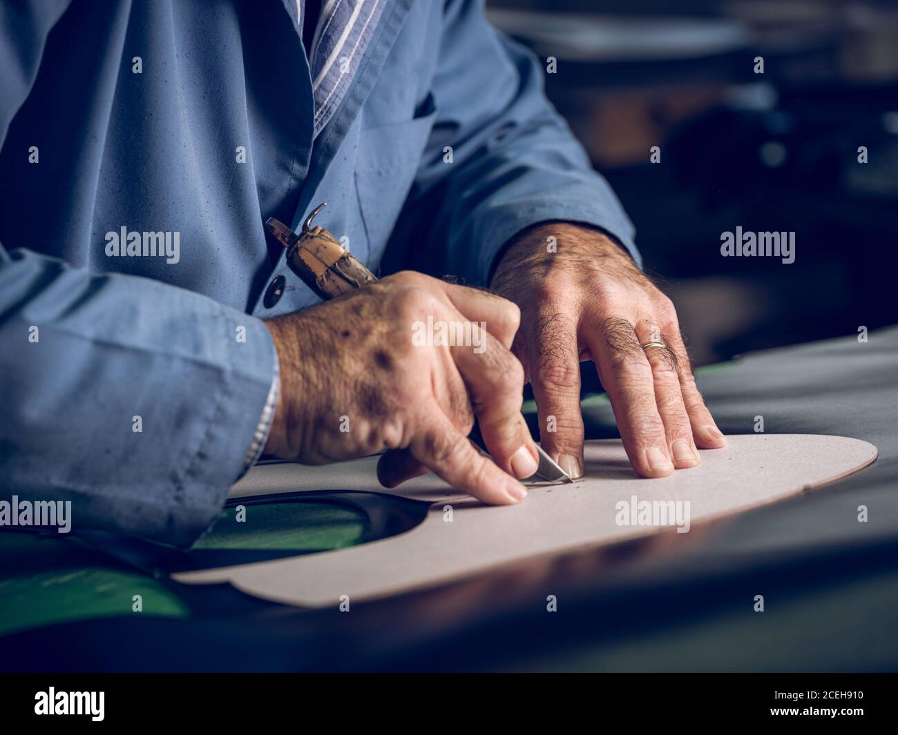Crop shoemaker cutting shoe template on leather Stock Photo - Alamy