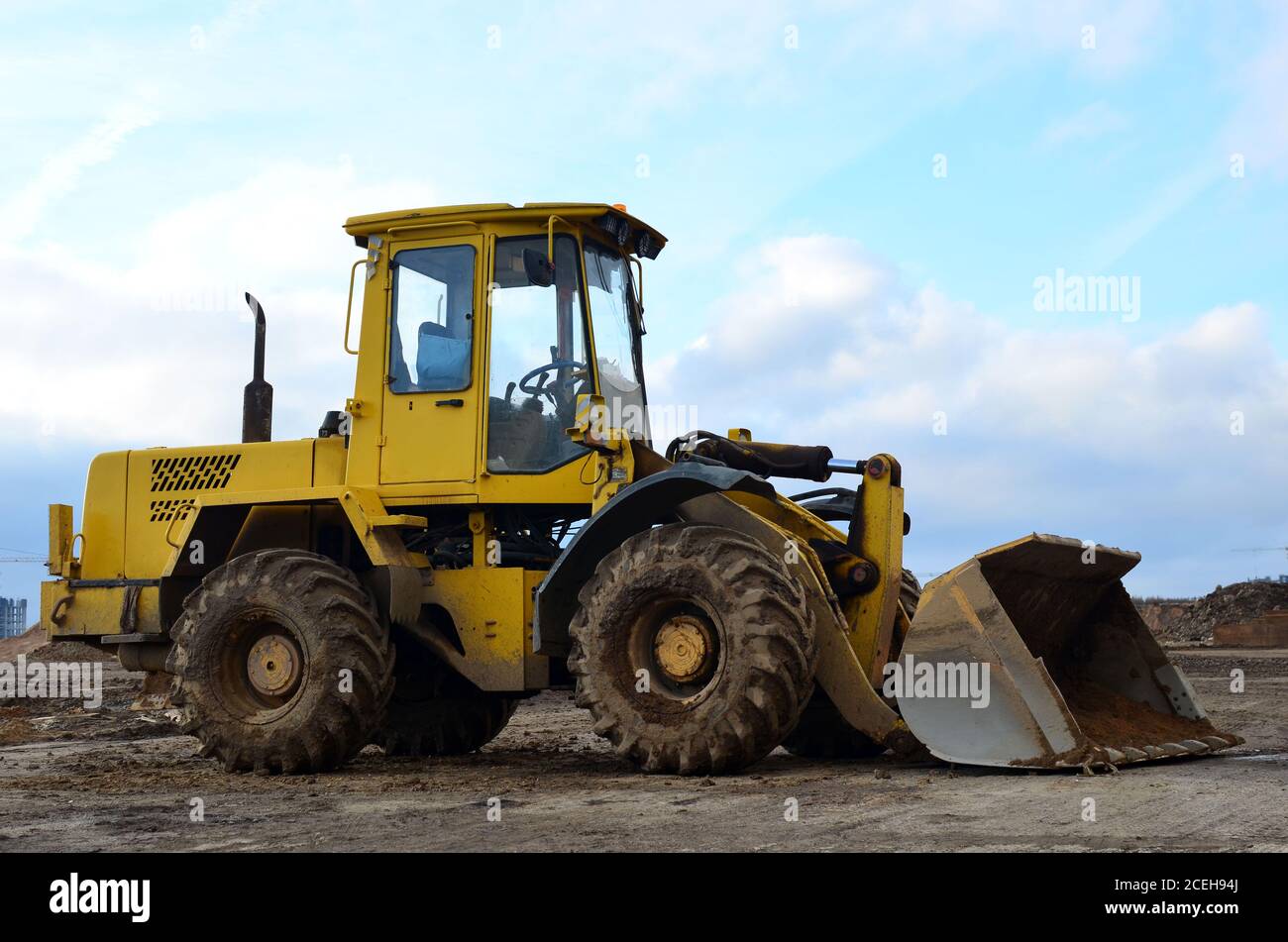 Front-end loader working on construction site during the renovation of ...