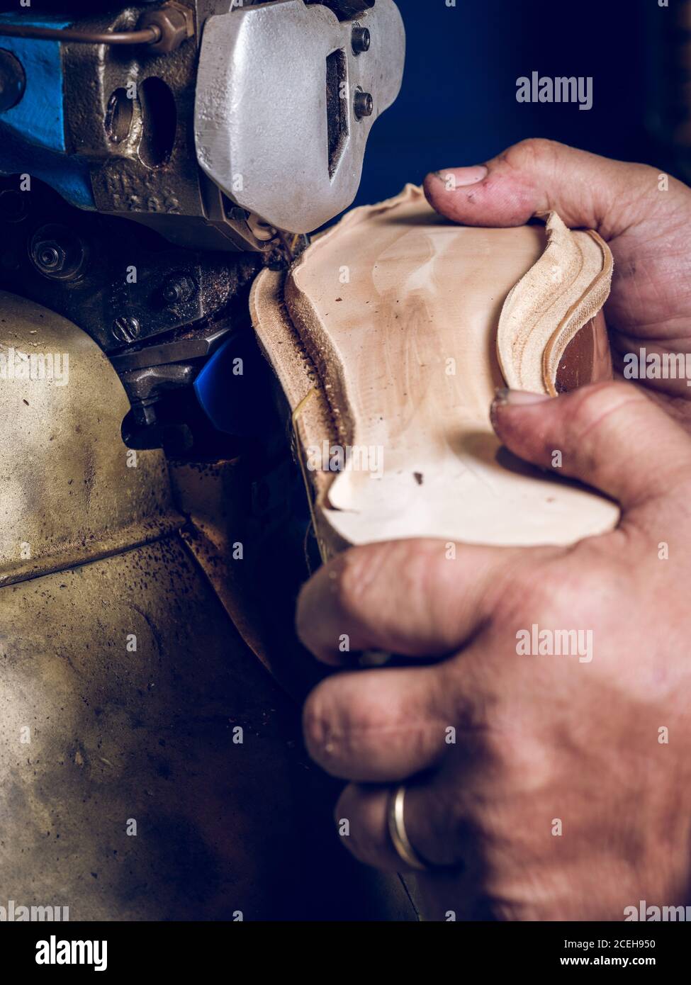 Crop craftsman making shoe on factory Stock Photo - Alamy