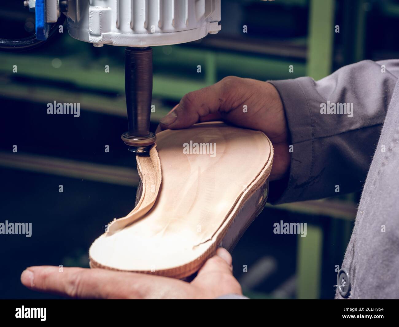 Crop craftsman making shoe on factory Stock Photo - Alamy