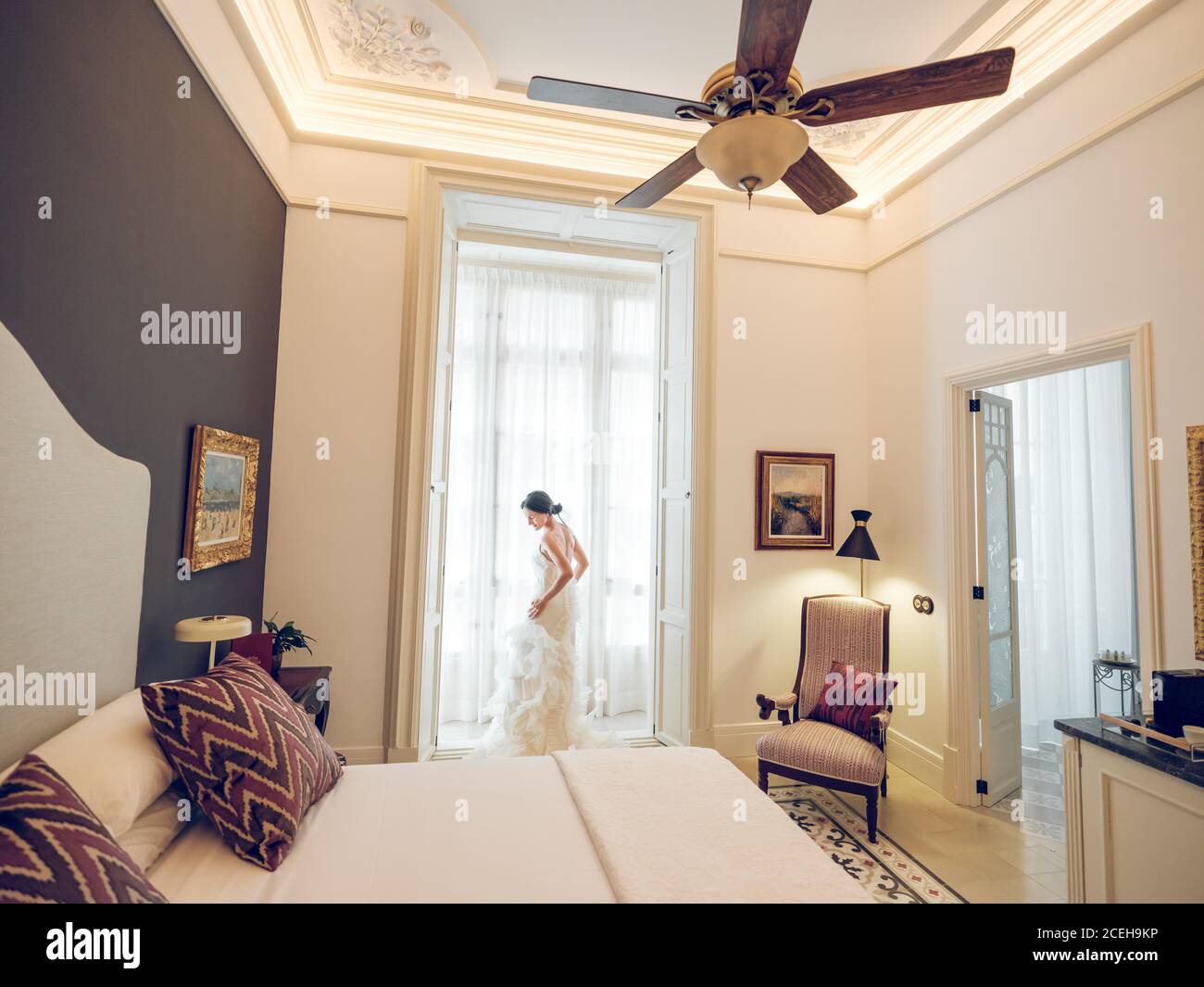 Bride standing in hotel room Stock Photo - Alamy