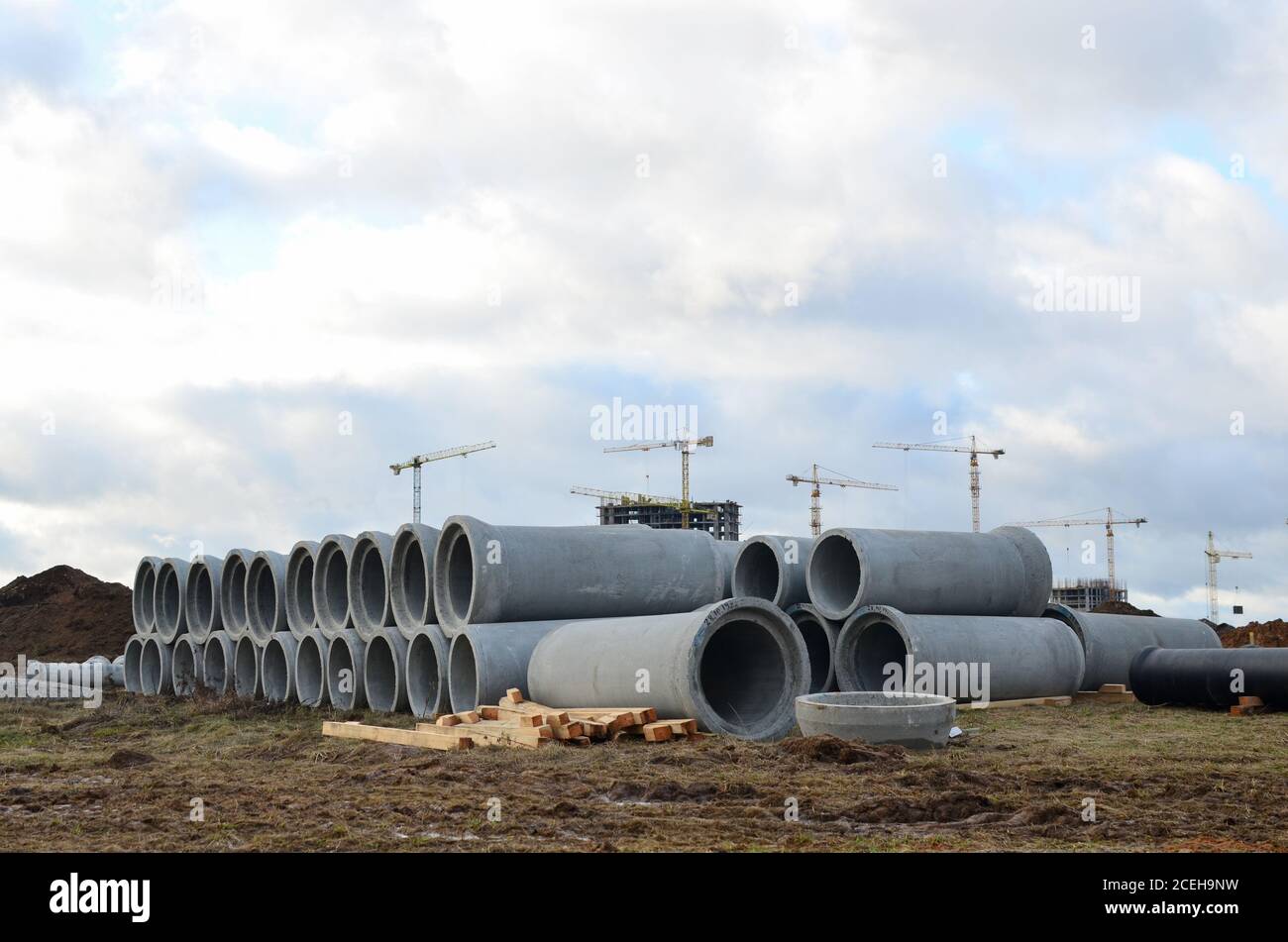 The drainage pipes at the large scale construction site against tower ...
