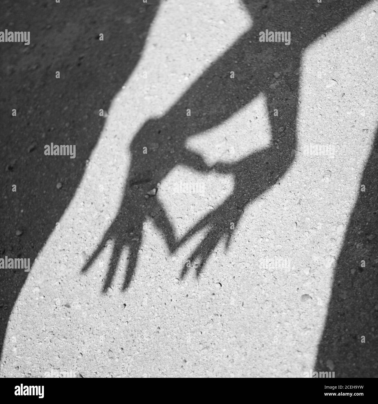 Shadow two hands forming heart hi-res stock photography and images - Alamy