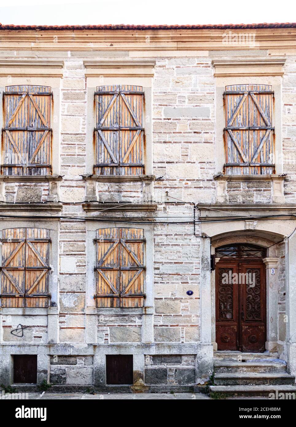 Old abandoned stone house front view Stock Photo - Alamy