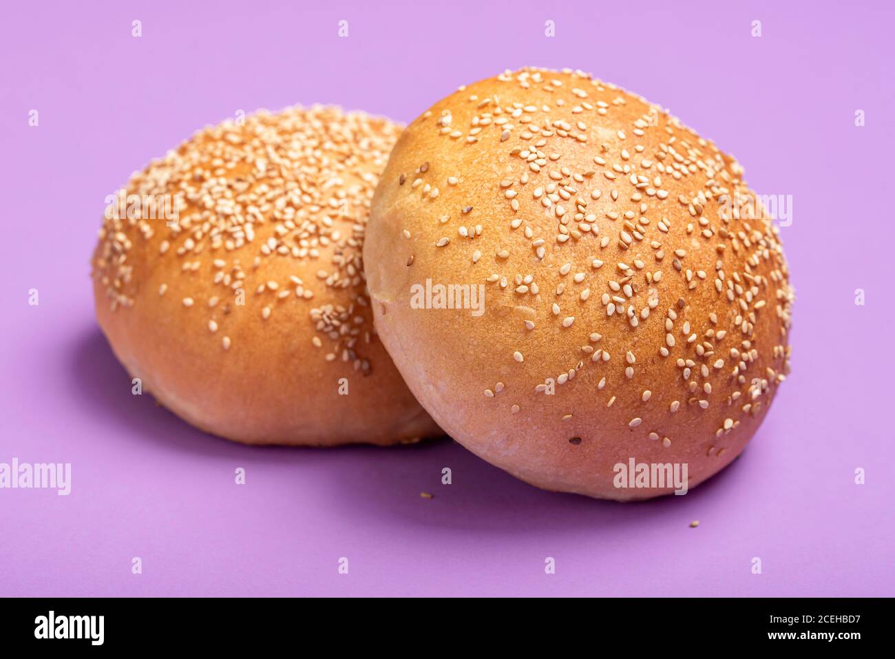 Bread buns close-up. Home-baked hamburger buns with sesame seeds ...