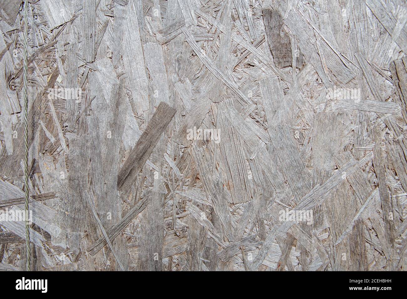 Pressed wooden panel background, seamless texture of oriented strand ...