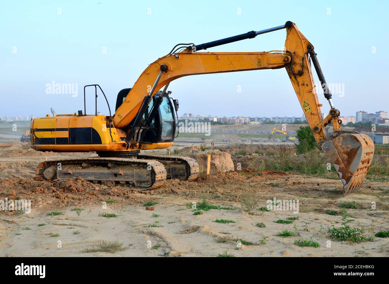 Hydraulic excavator installing pipeline hi-res stock photography and ...