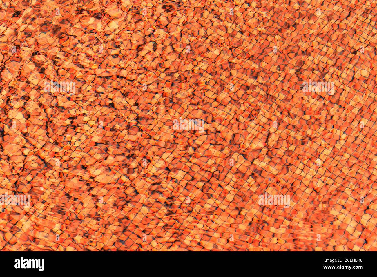 Orange abstract background texture. swimming pool bottom caustics ...