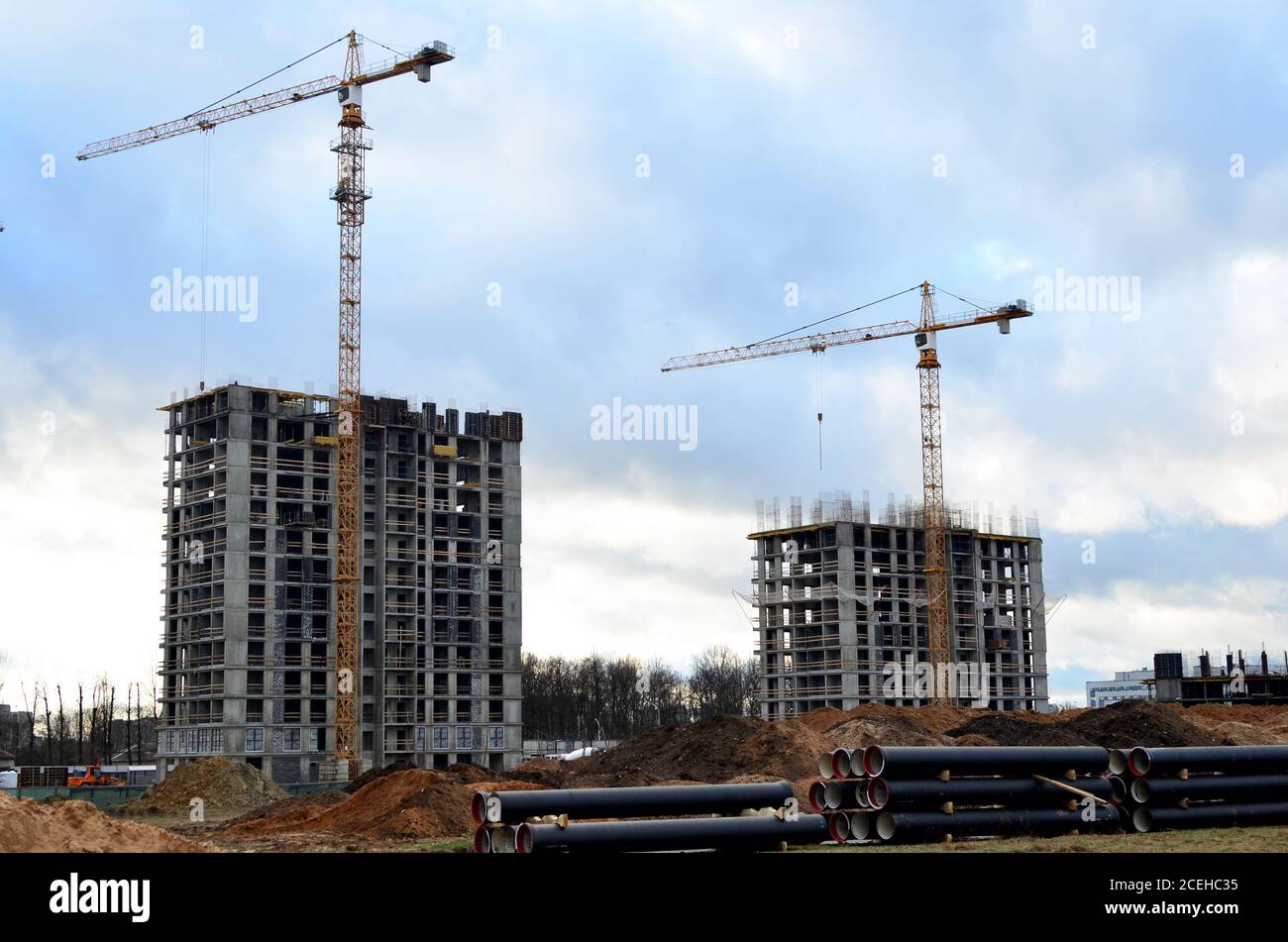 The drainage pipes at the large scale construction site against tower ...