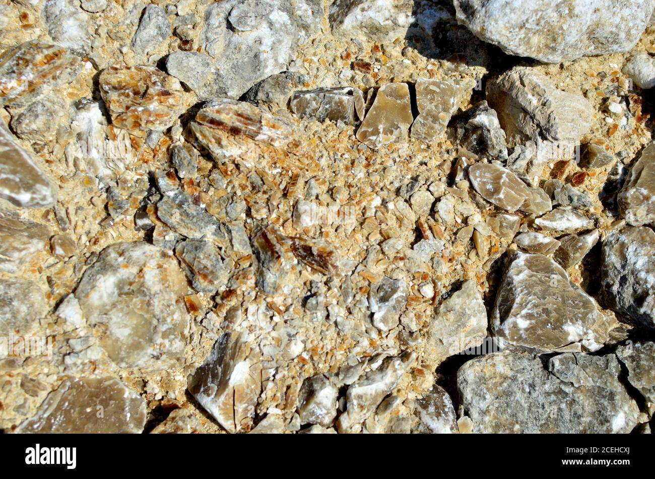 Natural gray gypsum stone. Close up image of stones with black and ...