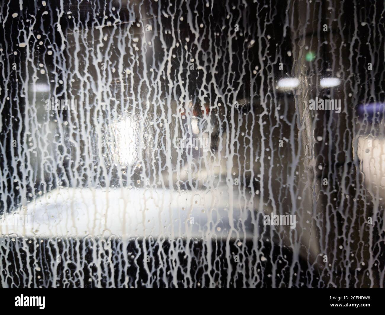 white water coolant emulsion streaming down on cnc machine window ...