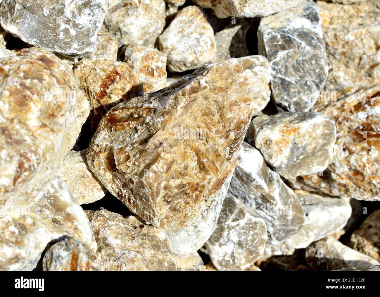 Natural gray gypsum stone. Close up image of stones with black and ...