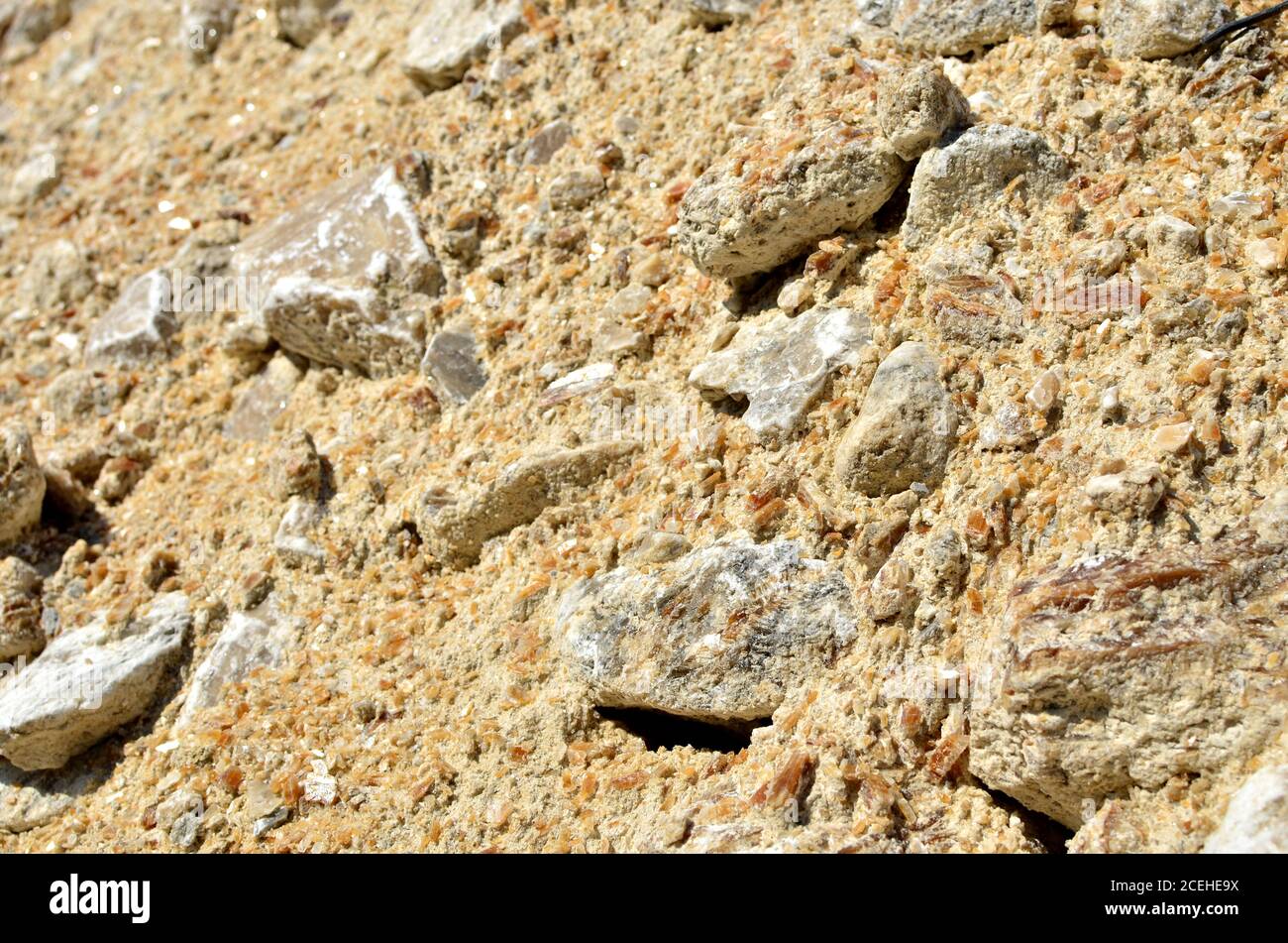 Natural gray gypsum stone. Close up image of stones with black and ...