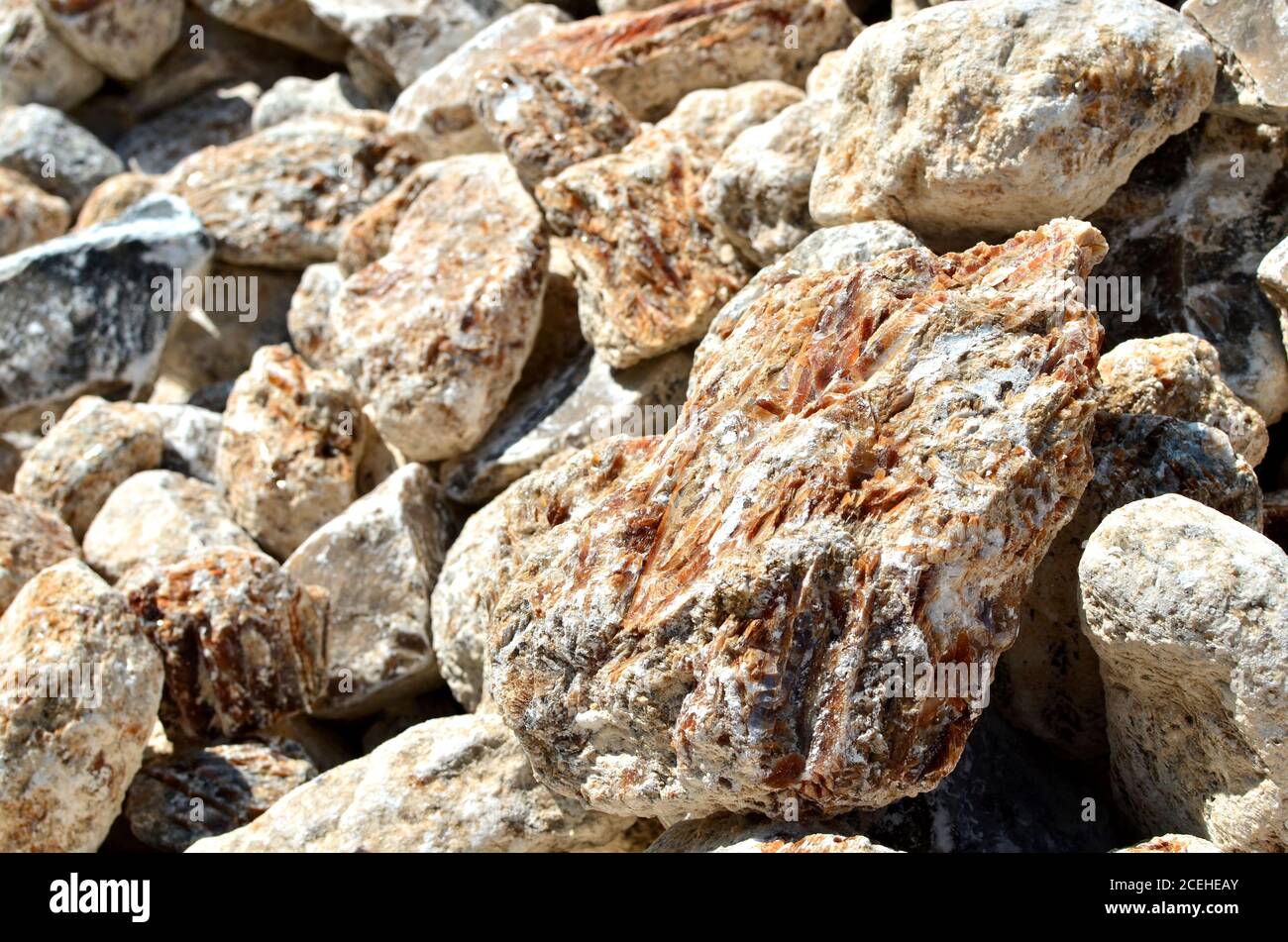 Natural gray gypsum stone. Close up image of stones with black and ...