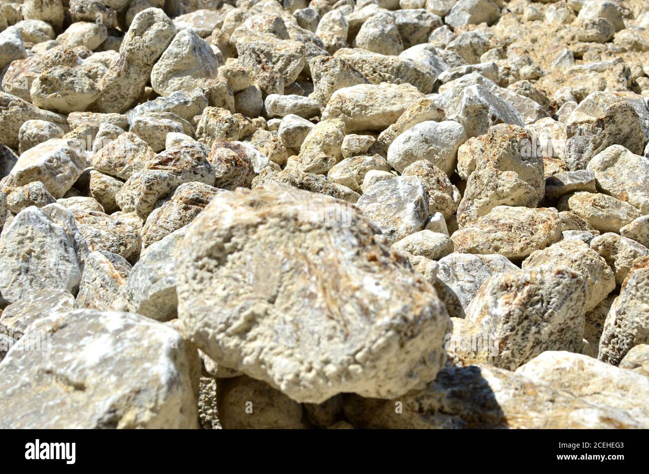 Natural gray gypsum stone. Close up image of stones with black and ...