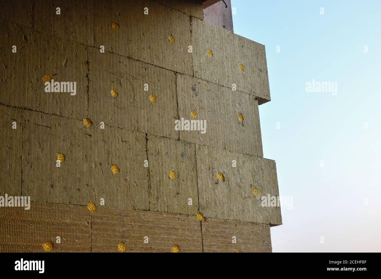 Mineral wool insulation of the facade building on construction site ...