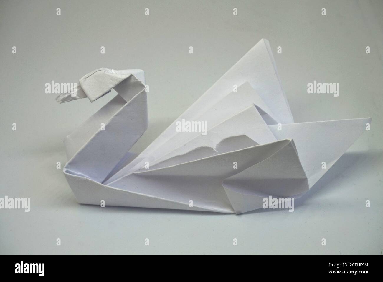 White origami swan made of paper Stock Photo - Alamy