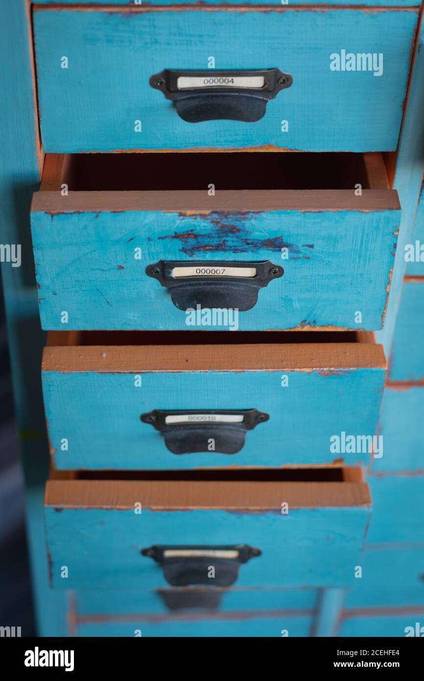 Old turquoise and brown colored wooden file and document cabinet with ...