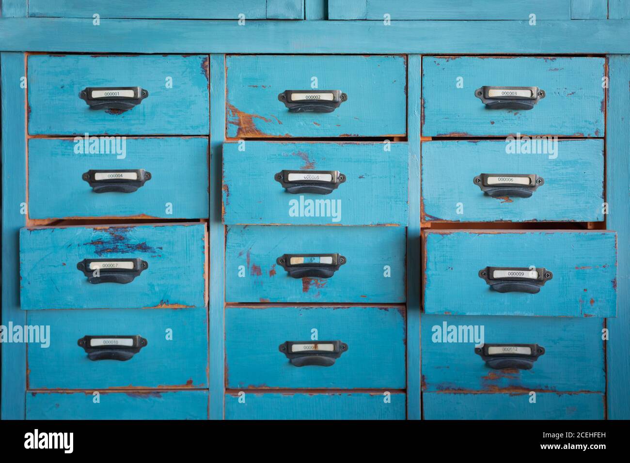 Old turquoise and brown colored wooden file and document cabinet with ...