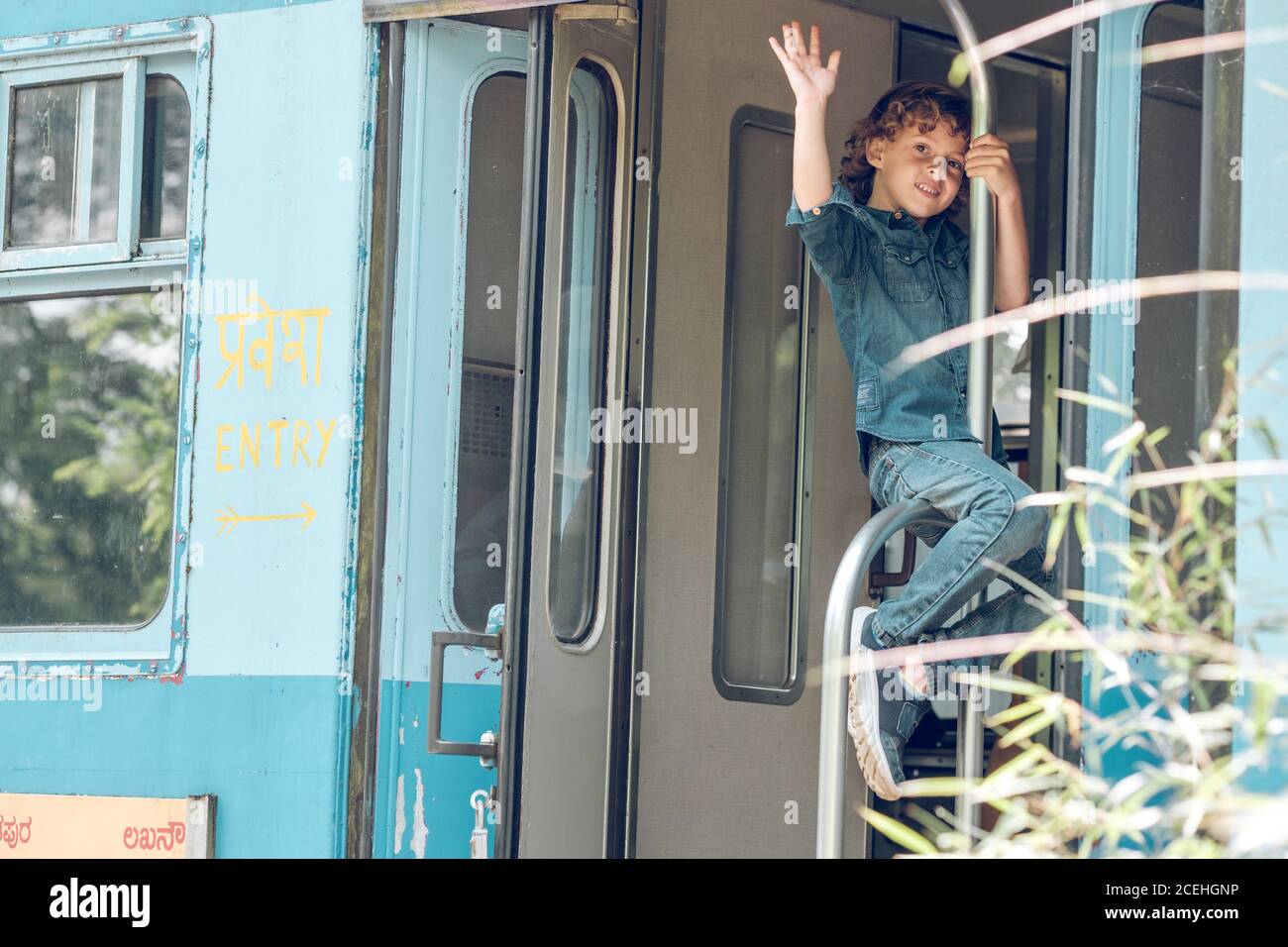 Kid in denim sitting inside of wagon Stock Photo - Alamy Kid in denim sitting inside of wagon Stock Photo - Alamy