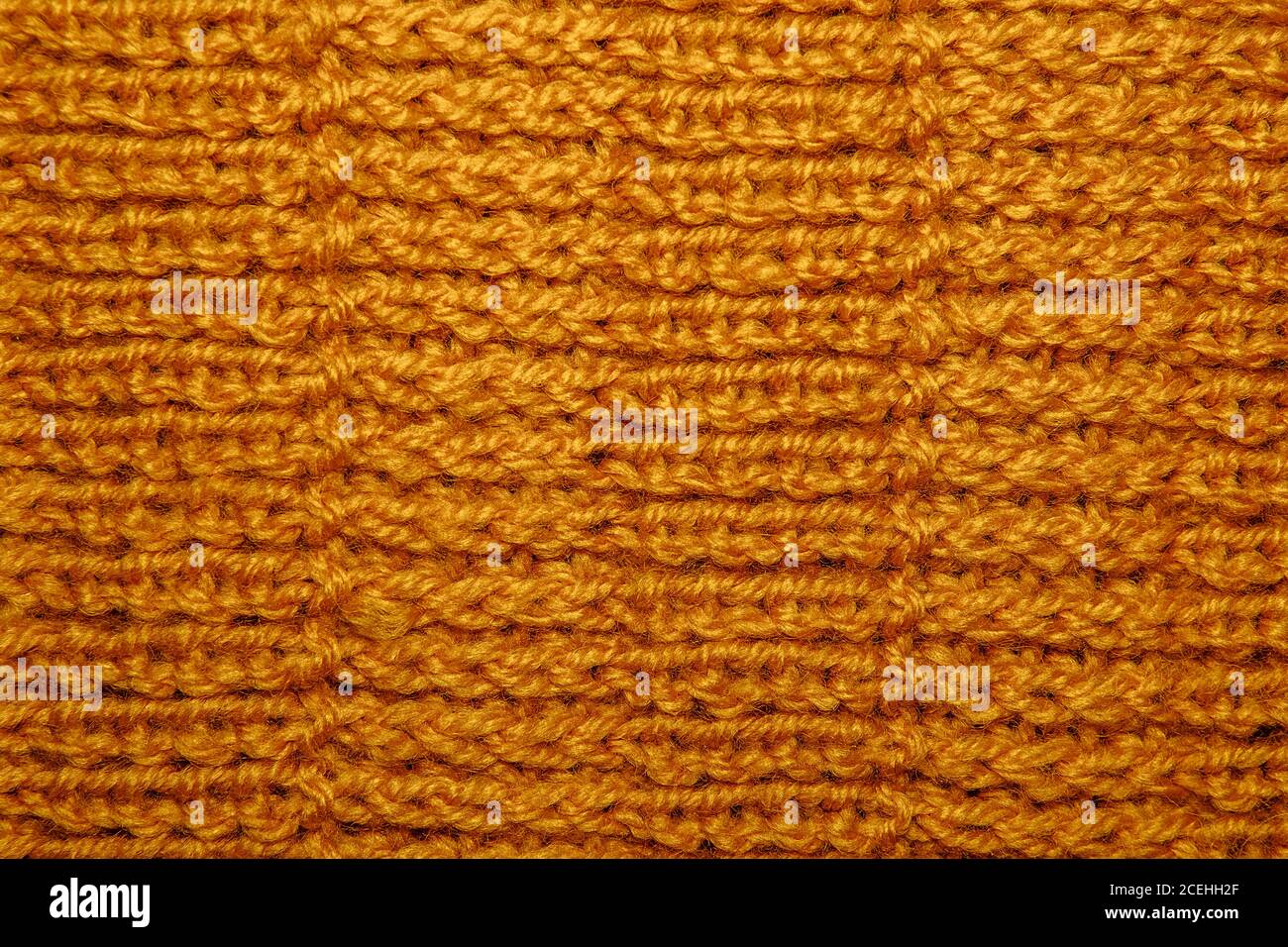 Wool hand-knitted mustard Pattern. Closeup Fabric Background Stock ...