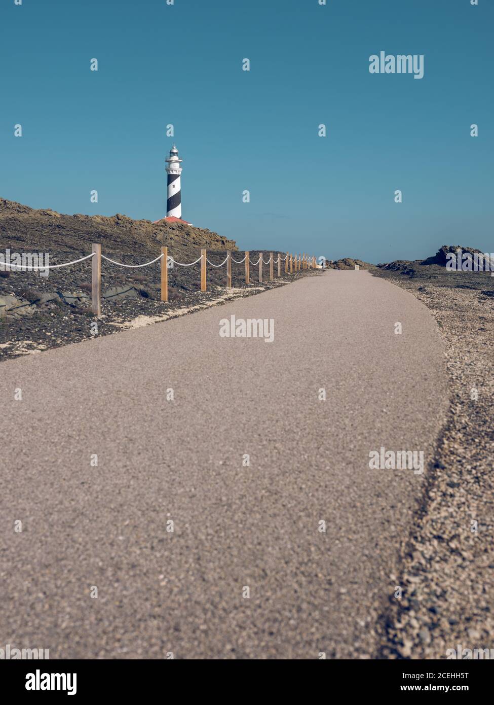 Asphalt road to lighthouse Stock Photo - Alamy