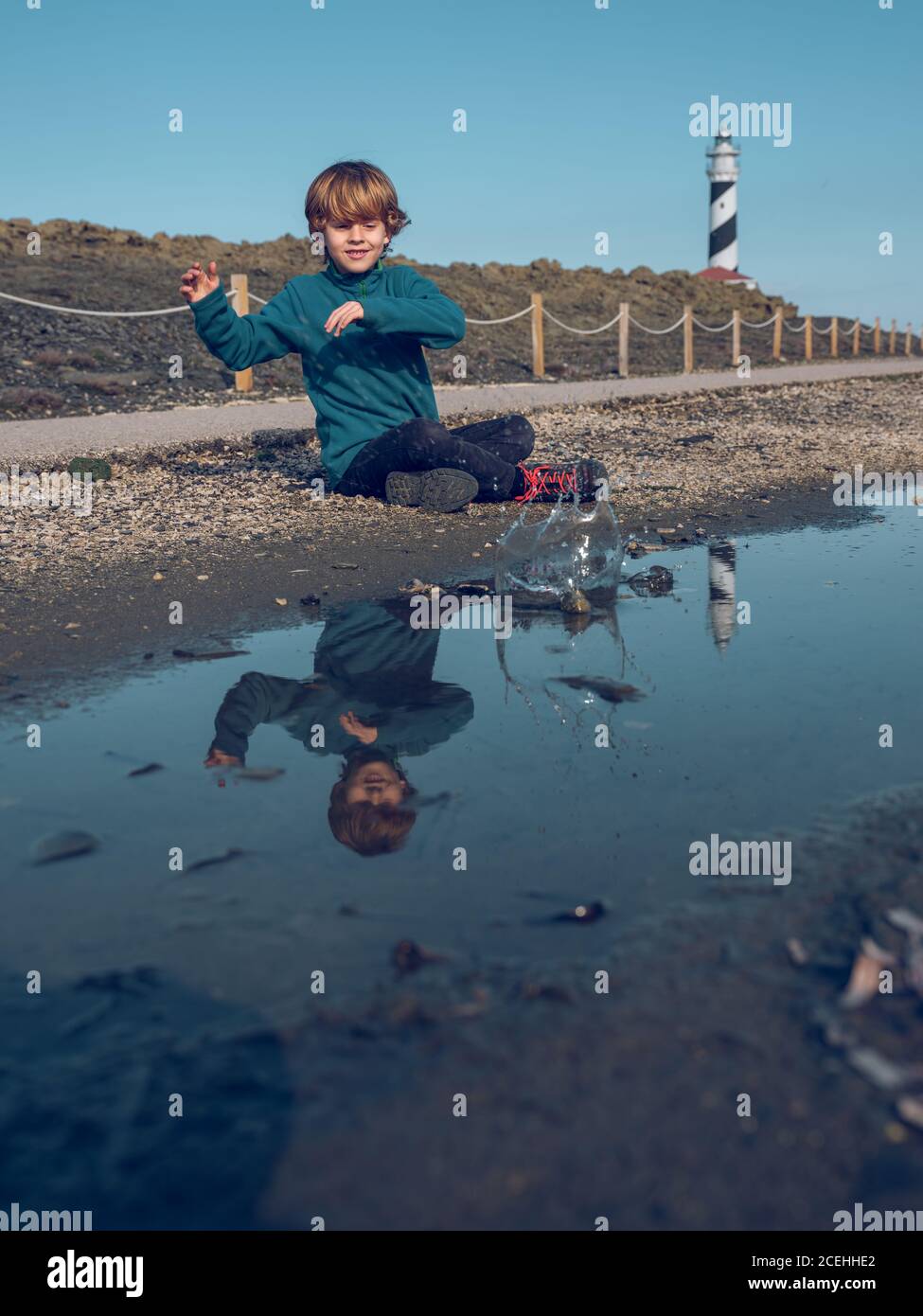 Boy puddle vertical hi-res stock photography and images - Alamy