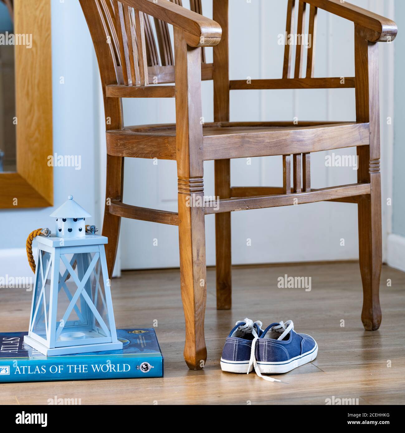 Atlas Blue Lantern Deck shoes and wooden chair Stock Photo - Alamy