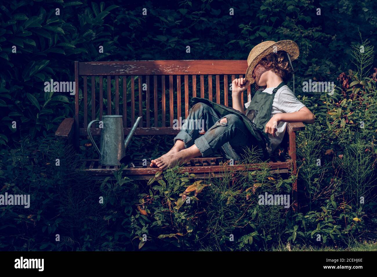 Boy sleeping on bench hi-res stock photography and images - Alamy