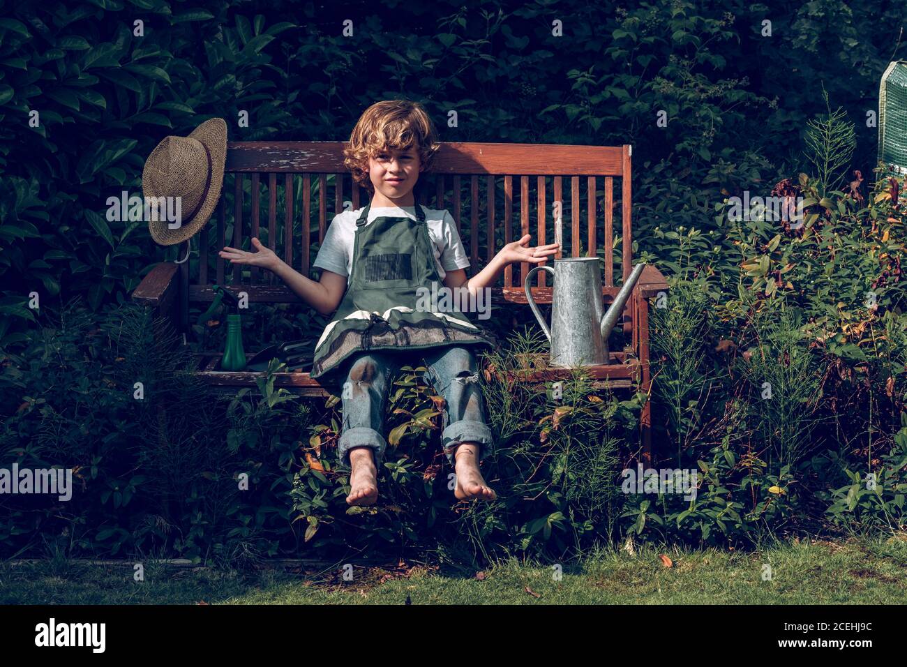 boy sitting on bench Stock Photo - Alamy