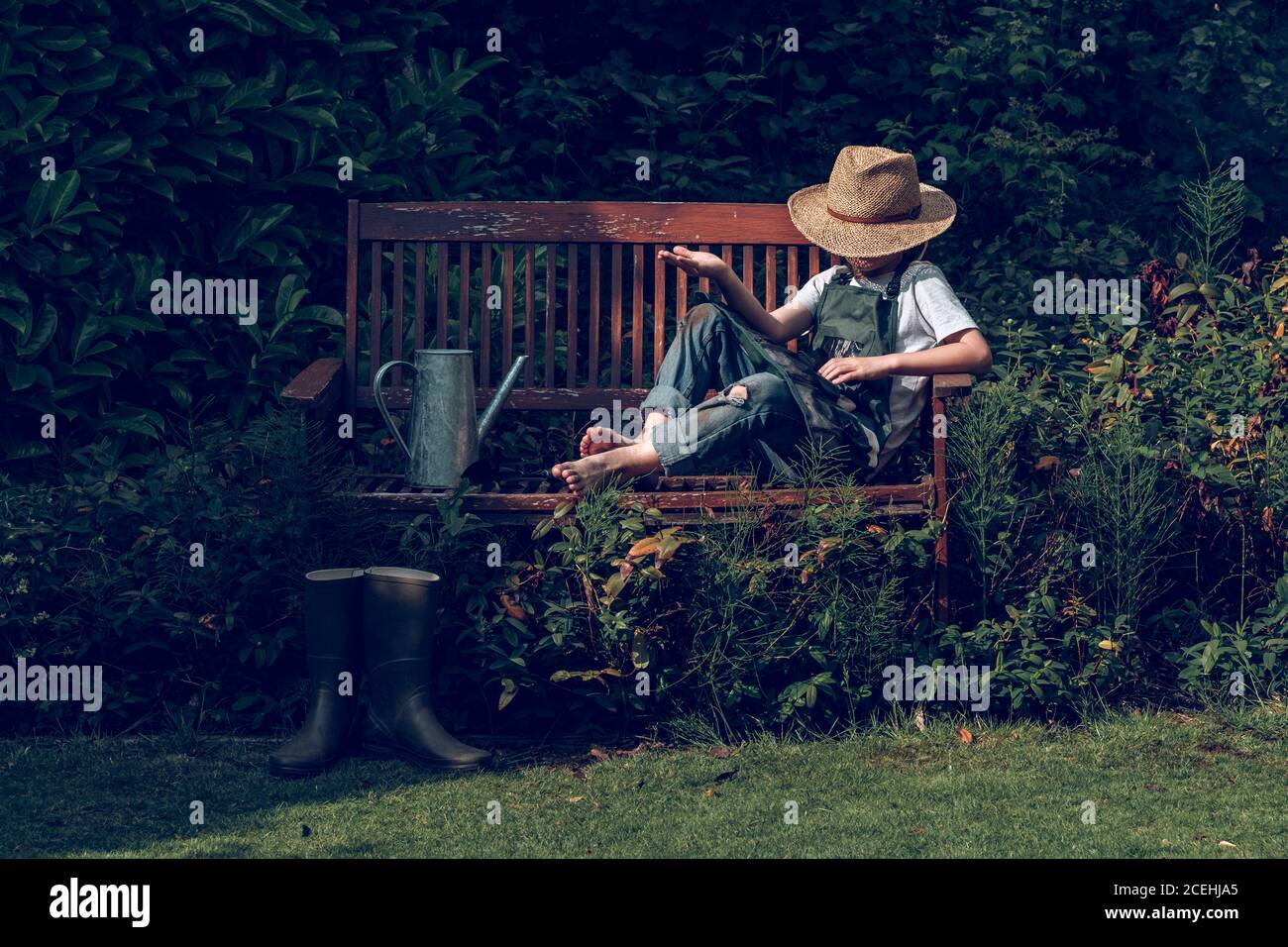 Boy sleeping on bench hi-res stock photography and images - Alamy