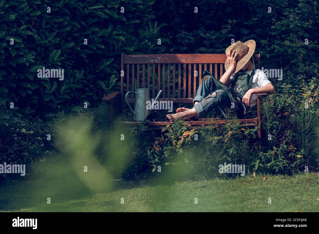 Boy sleeping on bench hi-res stock photography and images - Alamy