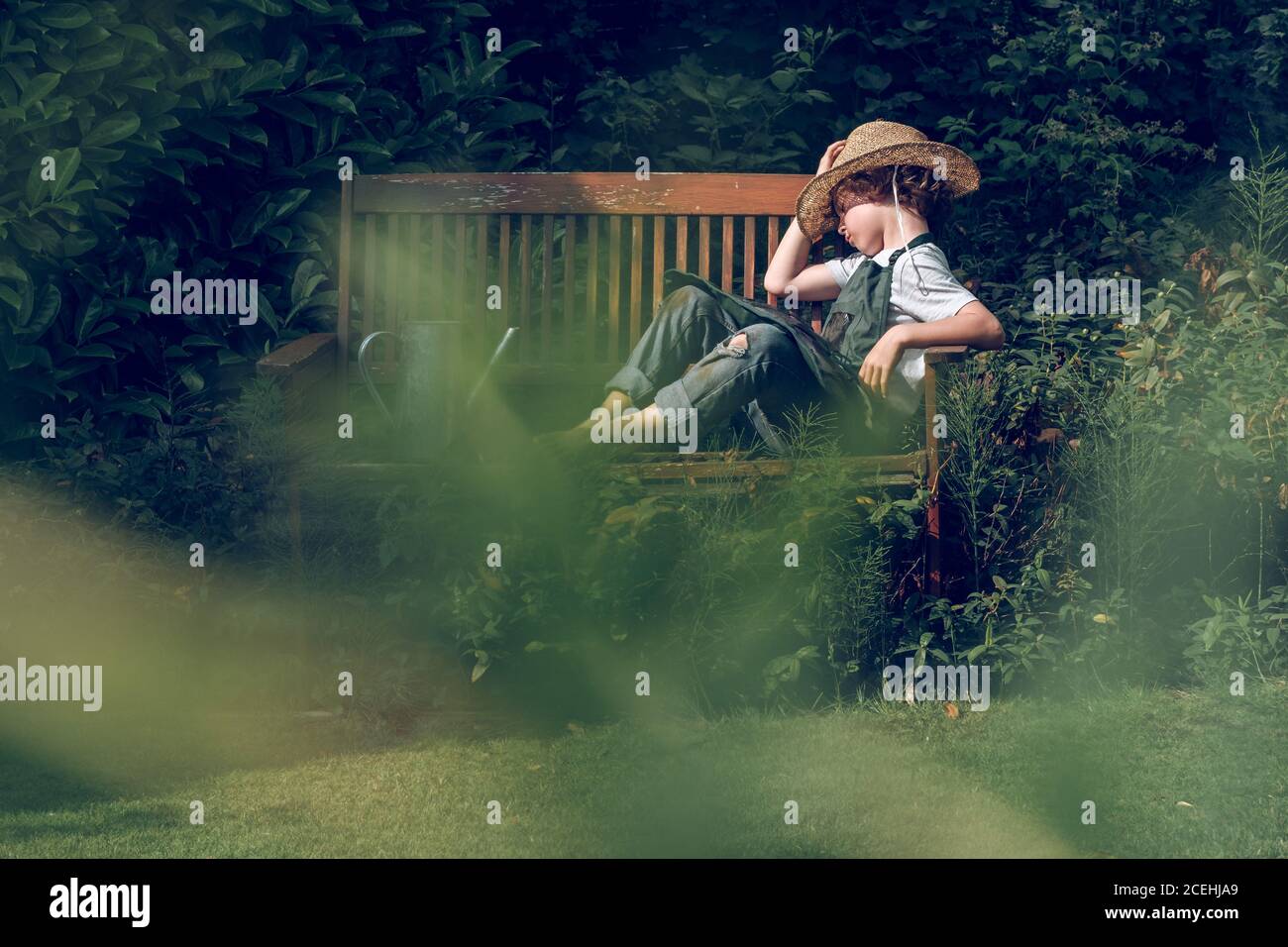 Boy sleeping on bench hi-res stock photography and images - Alamy