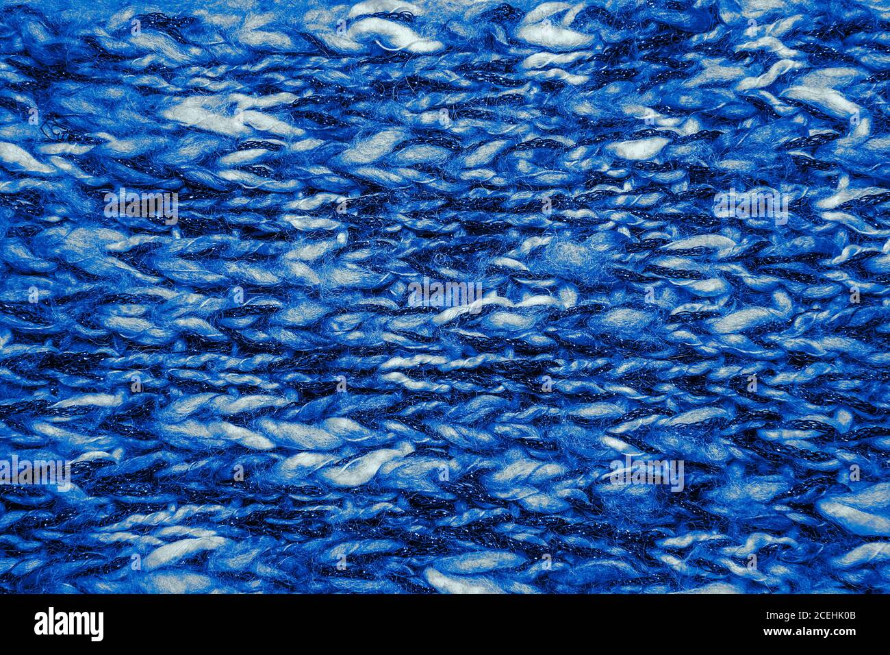 Close up on knit woolen fur texture. Blue melange fluffy woven thread ...