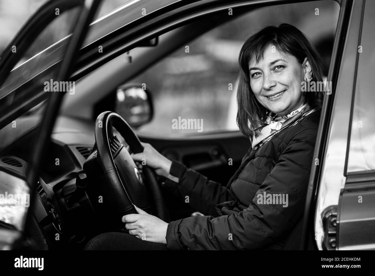Black woman driving a car Black and White Stock Photos & Images - Alamy
