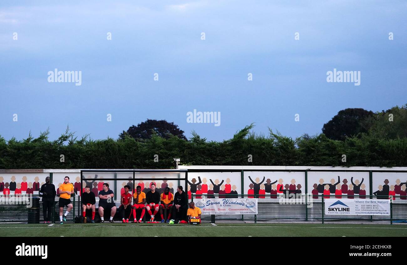 The Banstead Athletic bench look on during the FA Cup Qualifying match ...