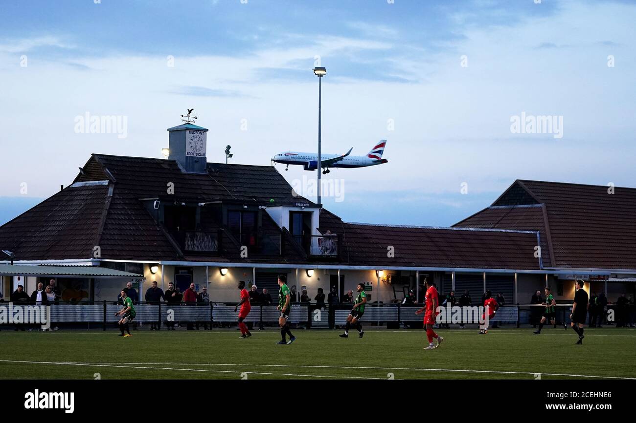 A plane flies over the ground during the FA Cup Qualifying match at Bedfont sports Club, Bedfont ...