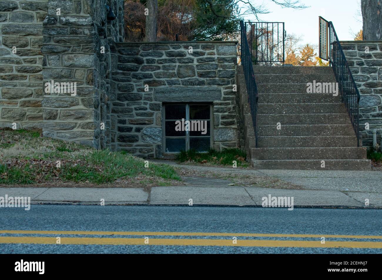 A window In a cobblestone church wall with steps next to it Stock Photo ...