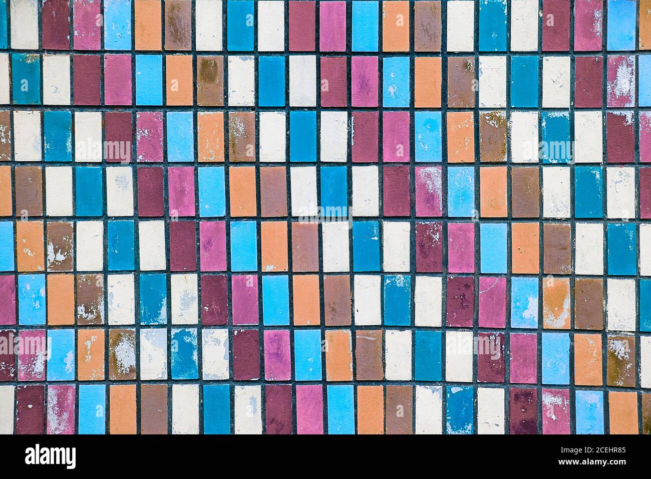 texture of old wall tiles with peeling bright paint. colorful old ...