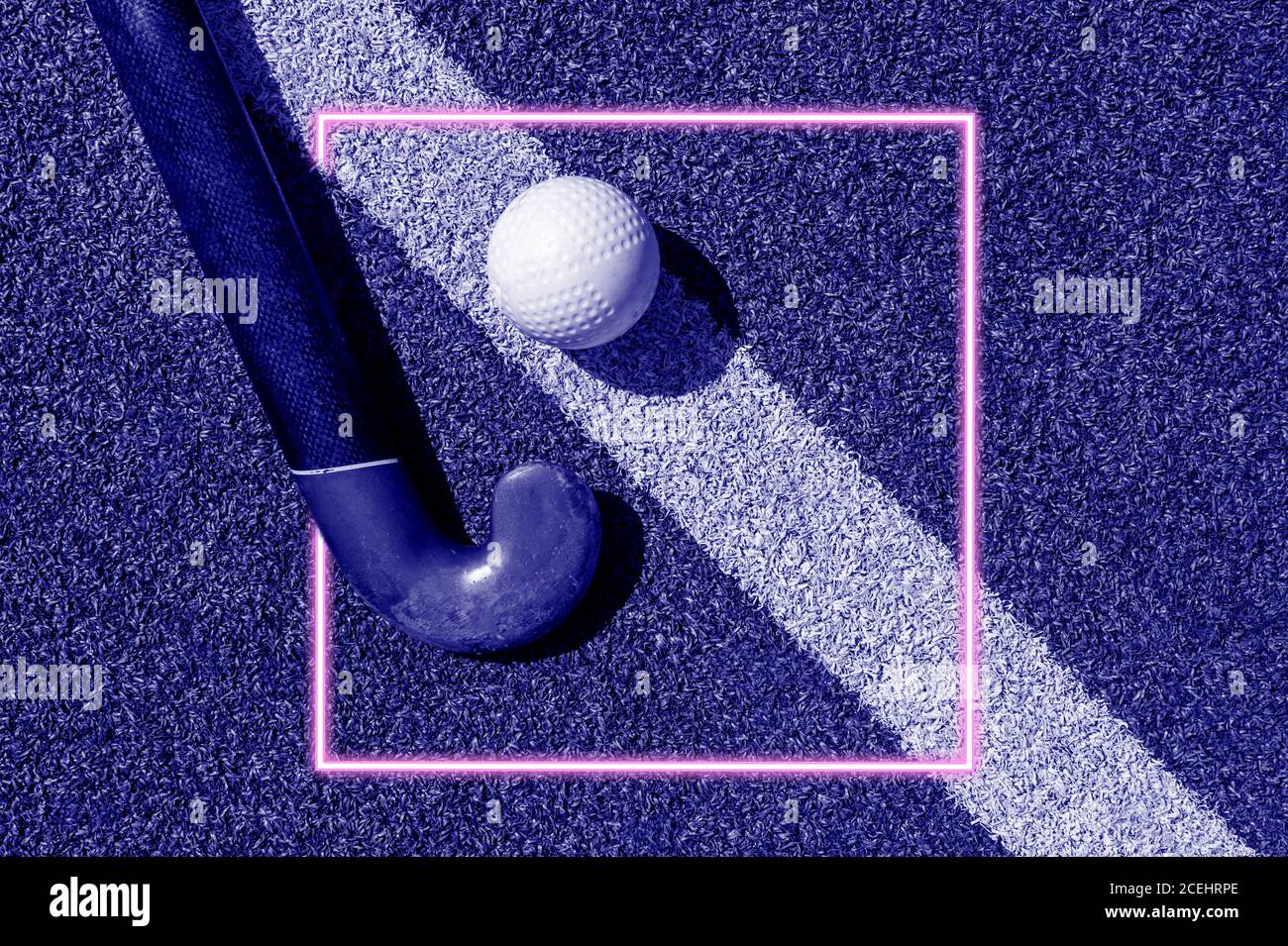 Field hockey stick and ball on field. Team sport concept. Blue color ...