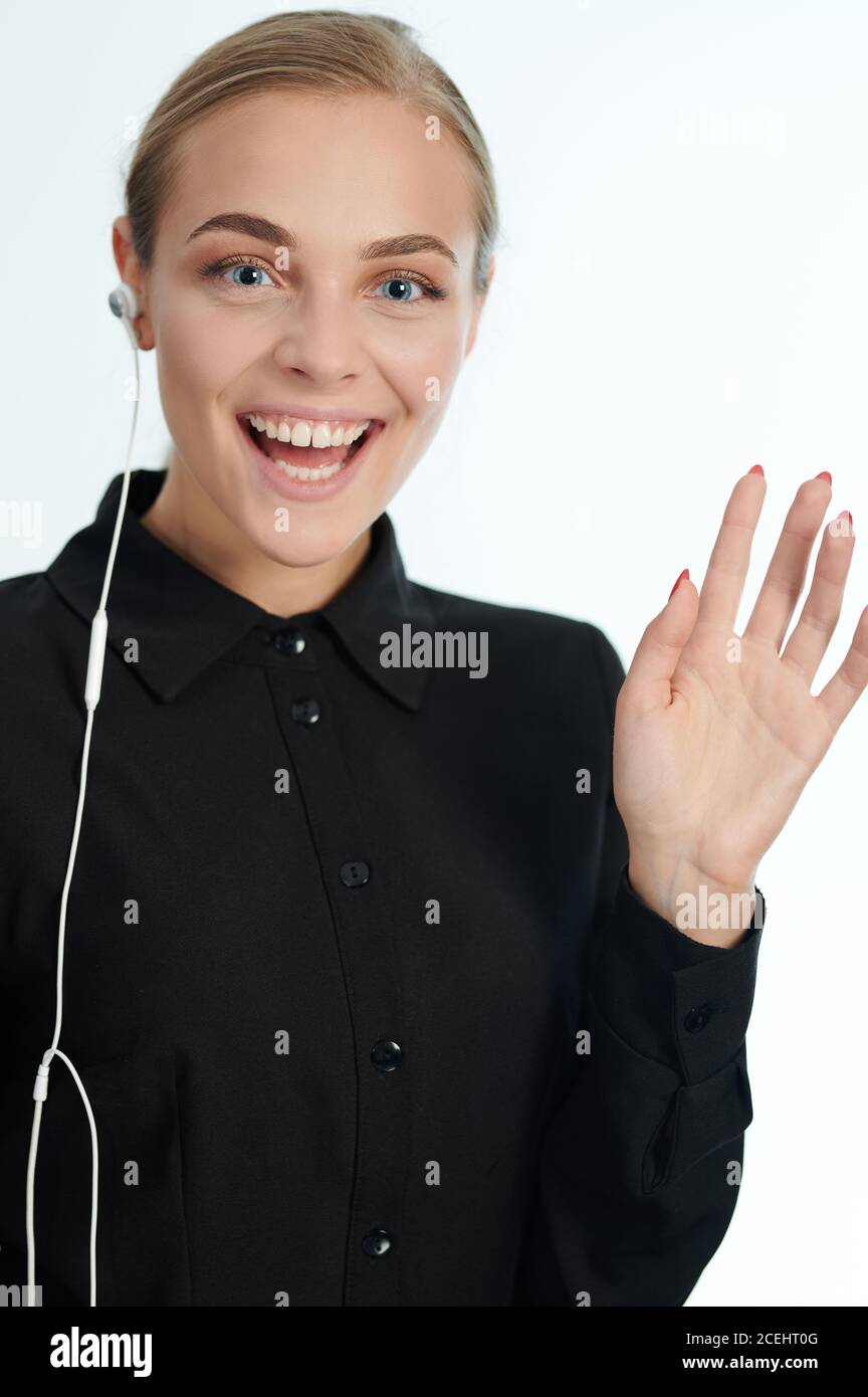Young woman say hello with hand up isolated on studio background Stock ...
