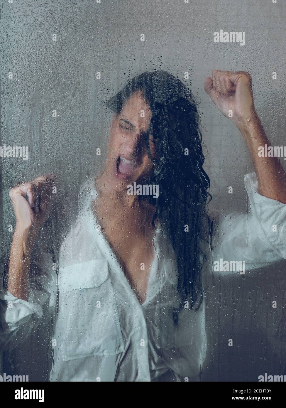 Sad woman crying in bathroom hi-res stock photography and images - Alamy